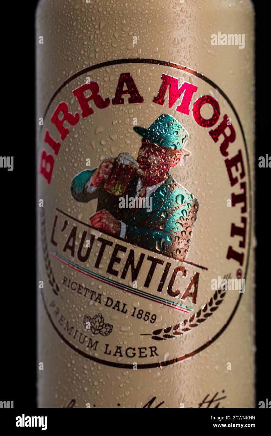 Birra Moretti, a premium lager beer with water droplets on black ...