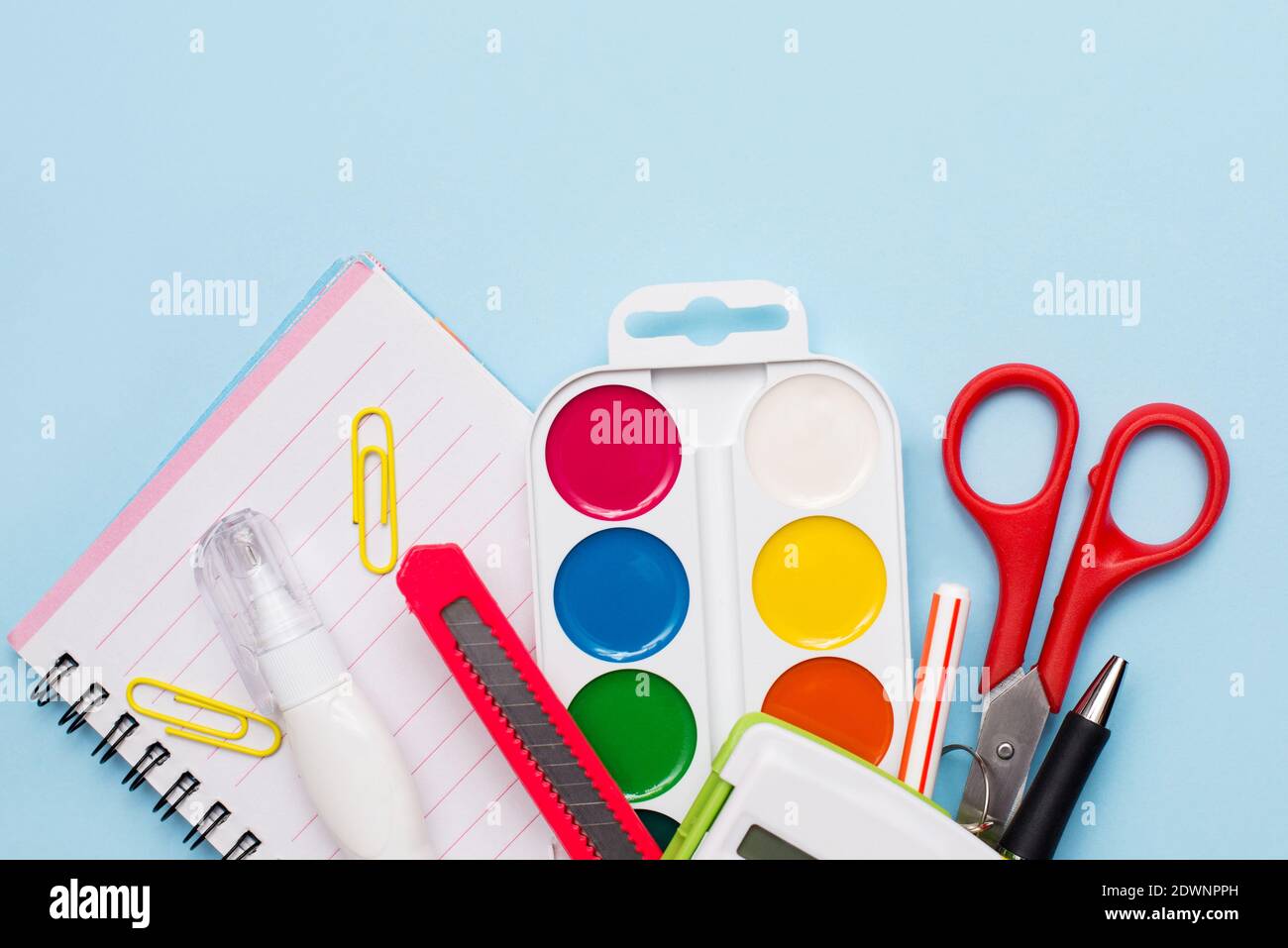 Bright colorful stationery on blue background with a copy space Stock ...