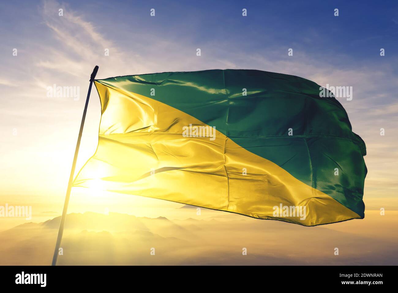 Ica of Peru flag waving on the top sunrise mist fog Stock Photo - Alamy