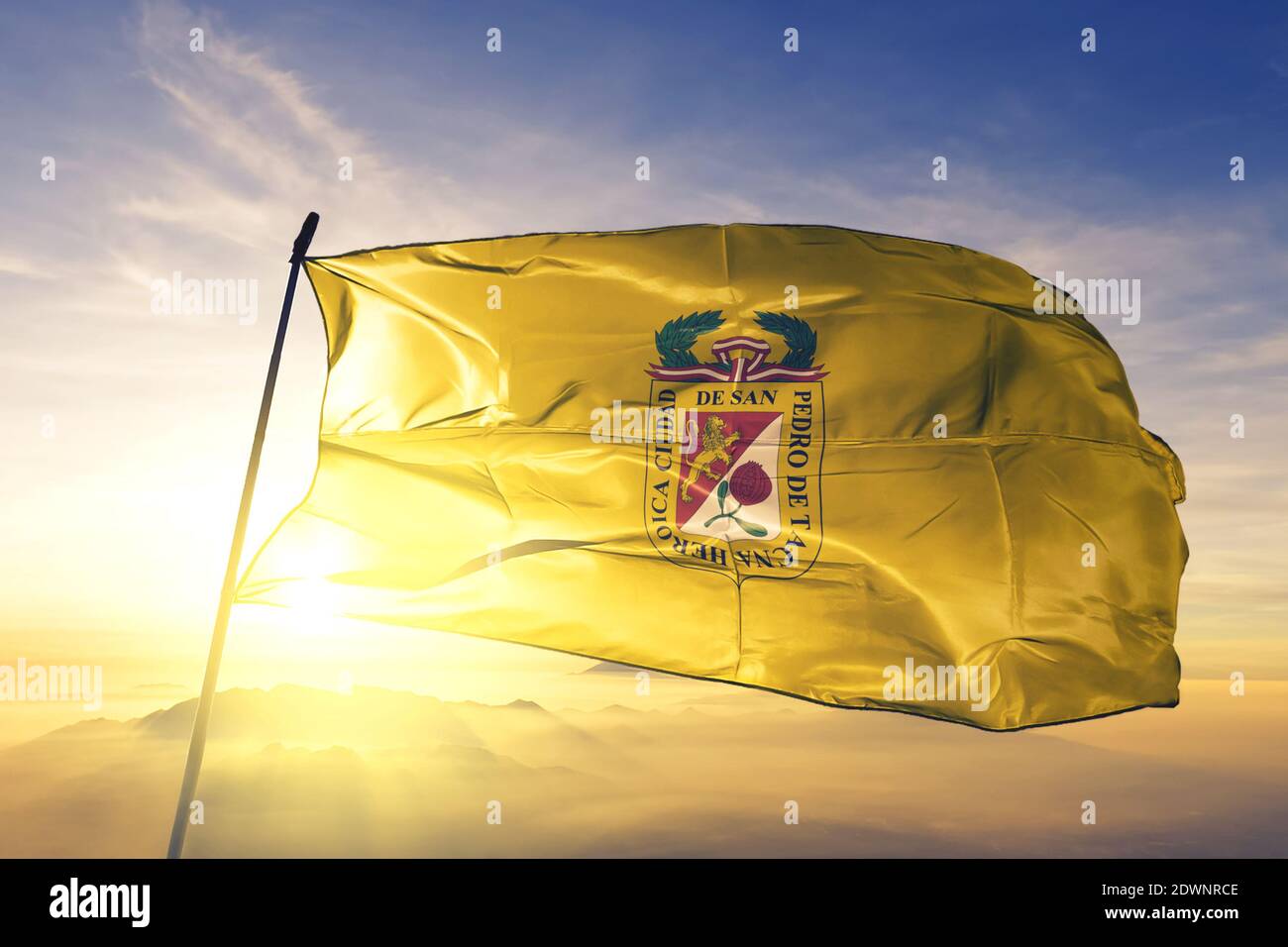 Tacna of Peru flag waving on the top sunrise mist fog Stock Photo - Alamy