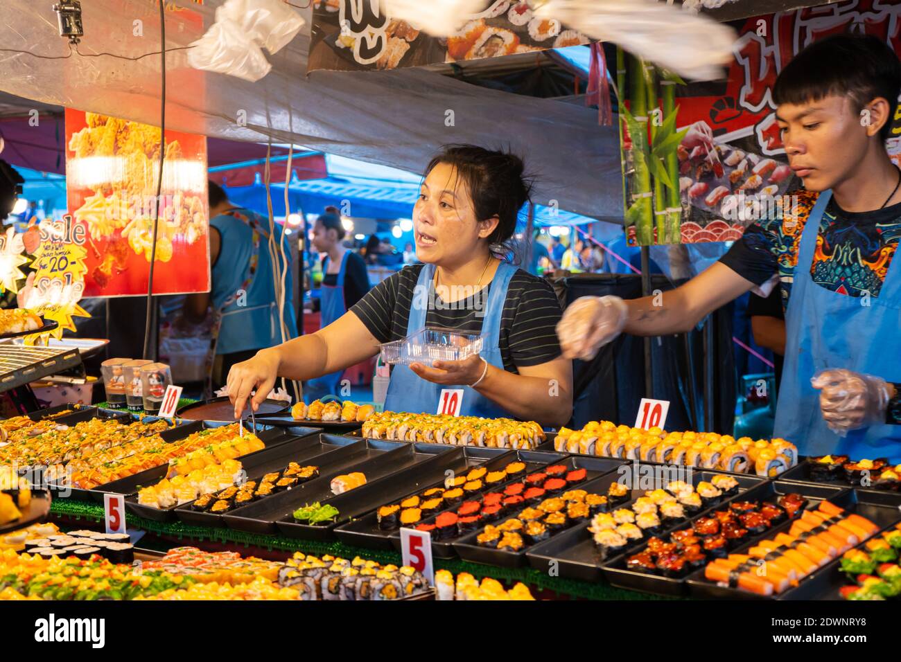 Night food market in asia. Outdoor sushi counters Stock Photo - Alamy