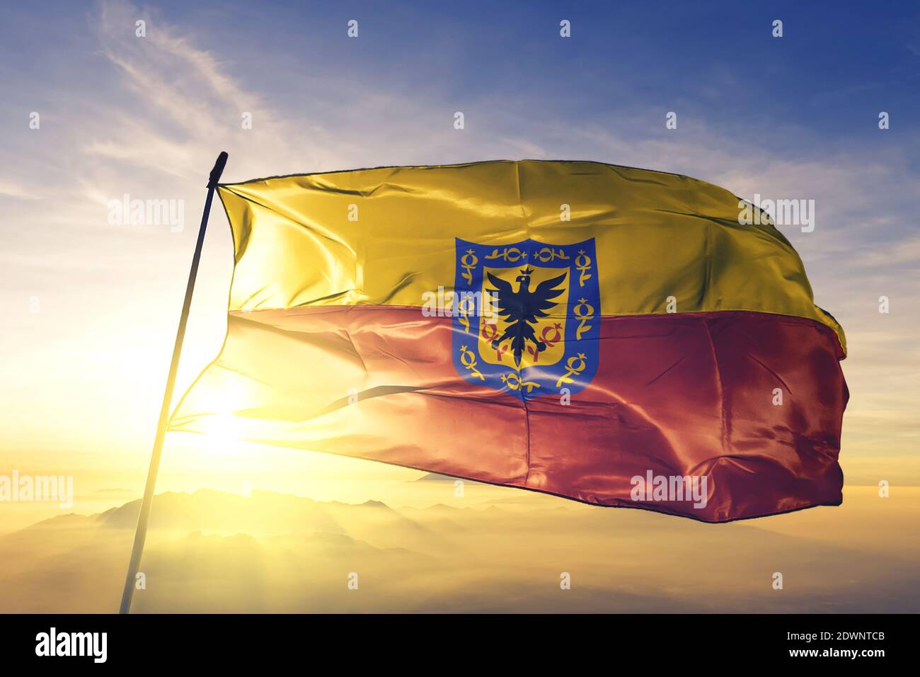 Bogota of Colombia flag waving on the top sunrise mist fog Stock Photo ...