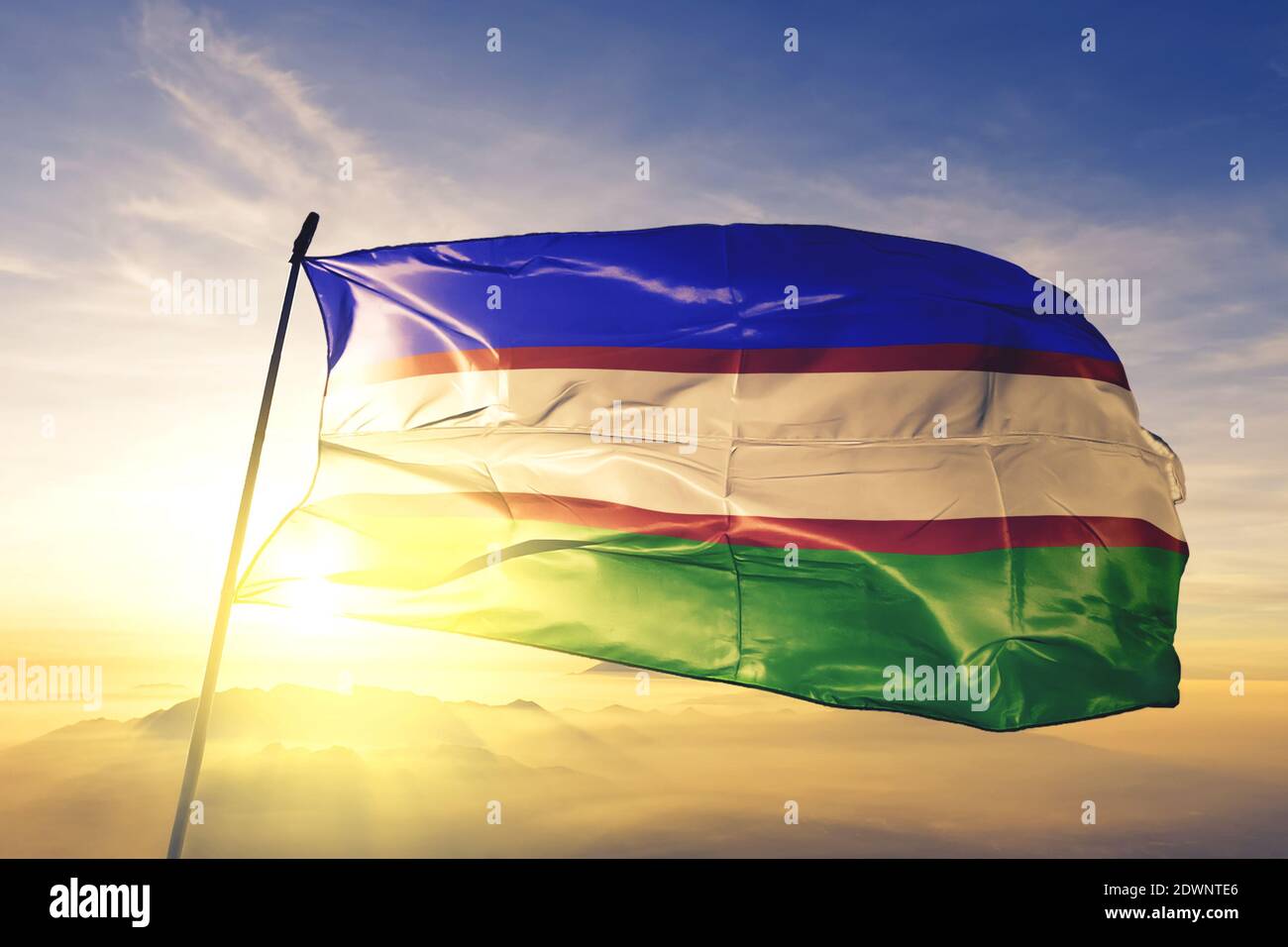 Santiago de Cali of Colombia flag waving on the top sunrise mist fog ...