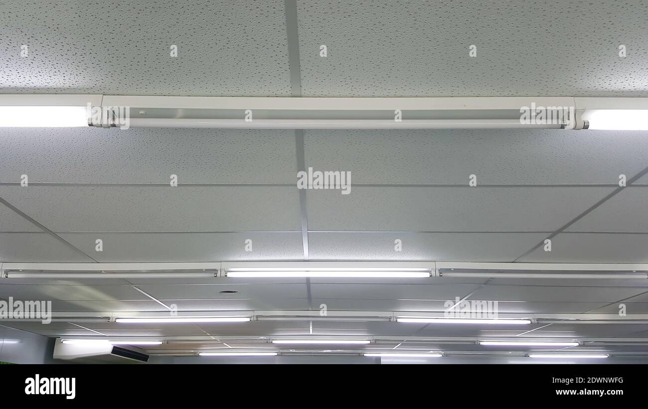 Closeup group of fluorescent lamps on the ceiling Stock Photo - Alamy