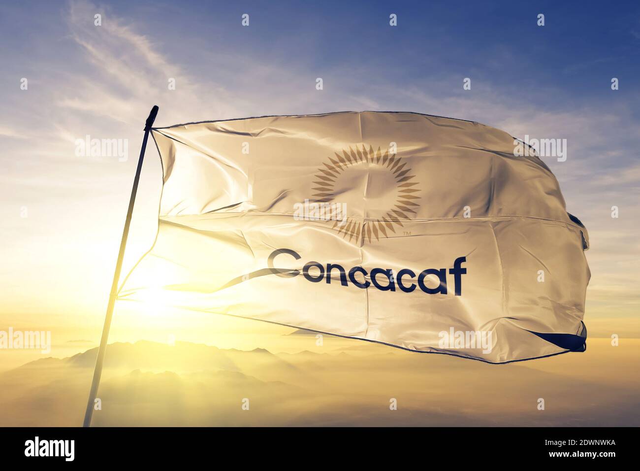 CONCACAF flag waving on the top sunrise mist fog Stock Photo - Alamy
