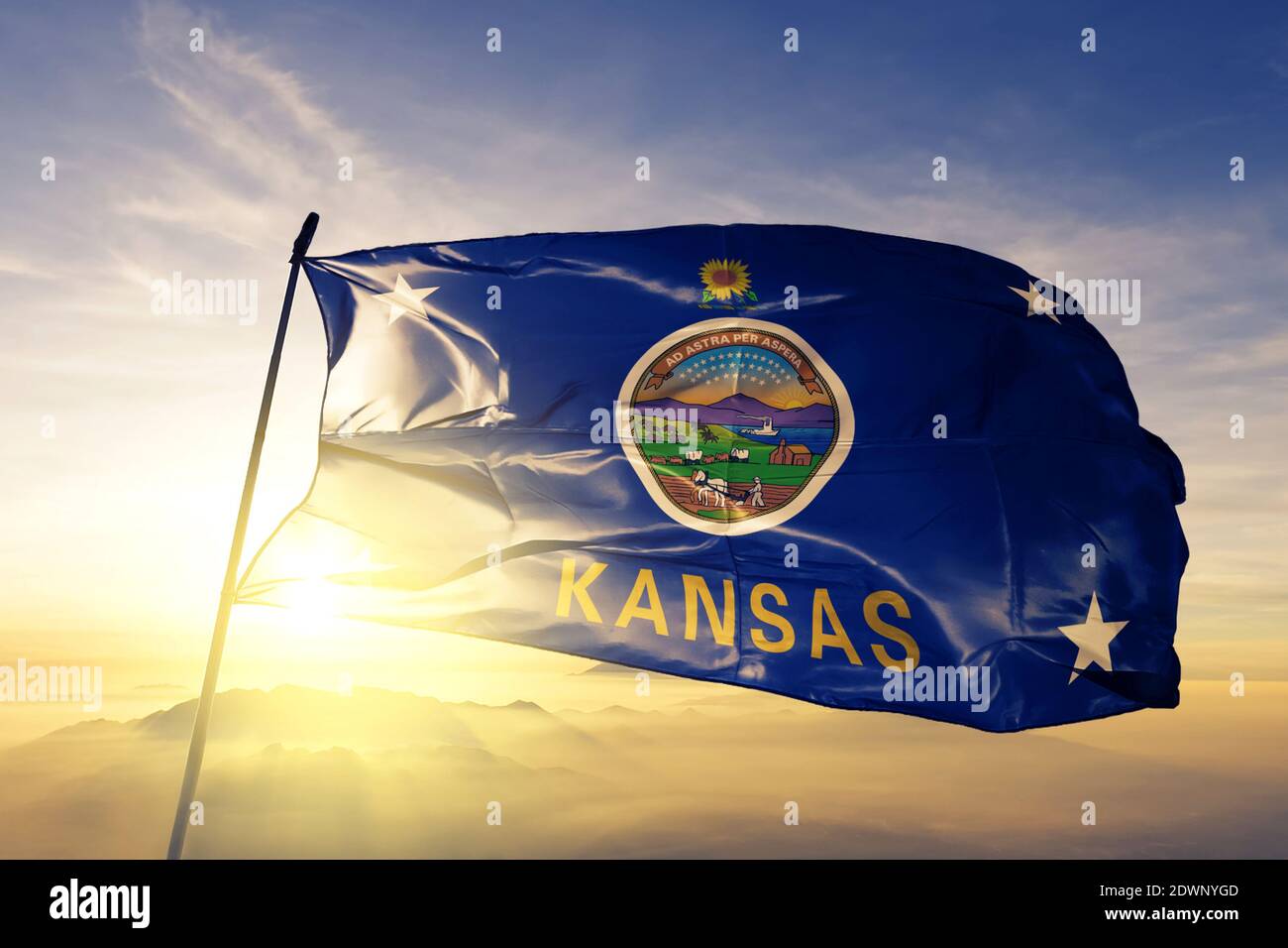 Governor of Kansas flag waving on the top sunrise mist fog Stock Photo ...