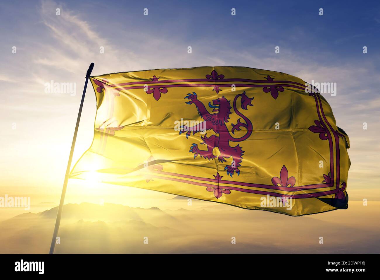 Royal Banner of Scotland flag waving on the top sunrise mist fog Stock ...