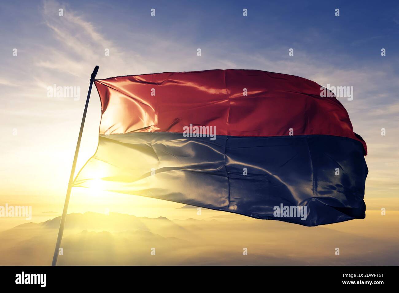 Red and black flag of Ukrainian nationalists flag waving sunrise mist ...