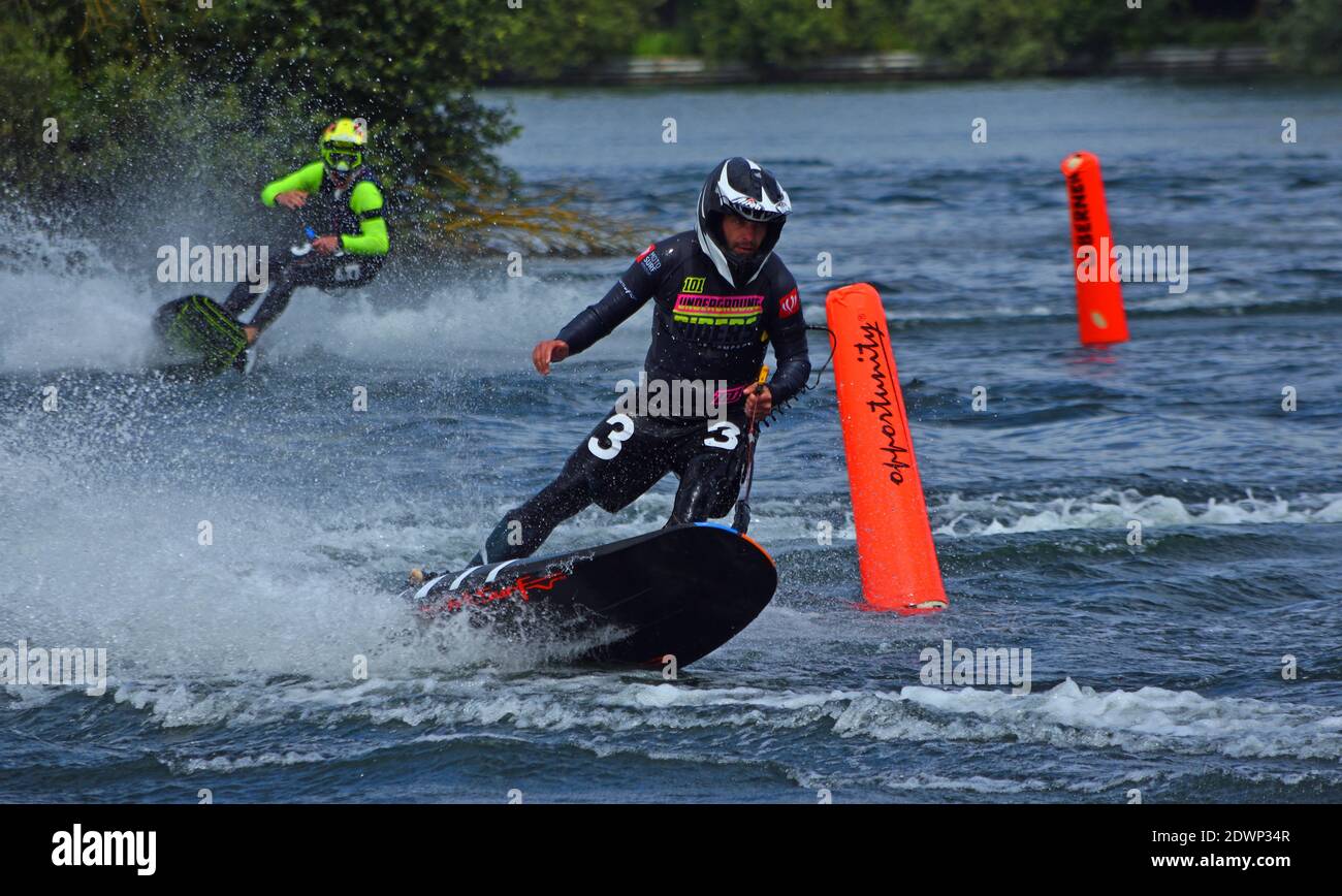 Male Motorsurf Competitor moving at speed other racers in background ...