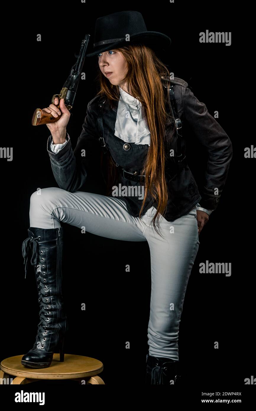 Cowgirl with gun hi-res stock photography and images - Alamy