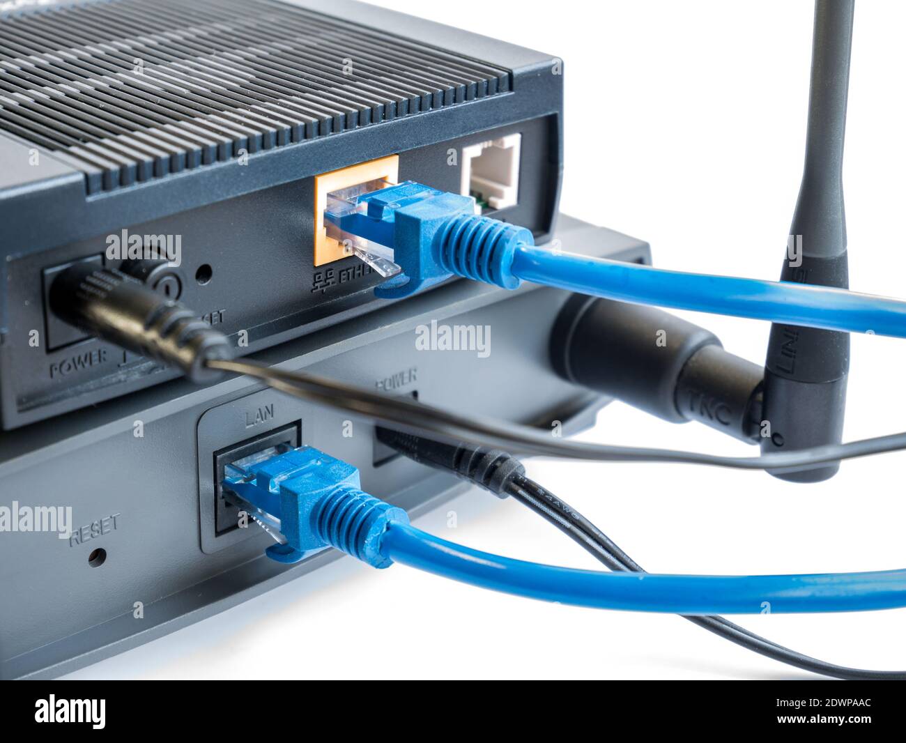 Internet router and wireless access point with cable isolated on white ...