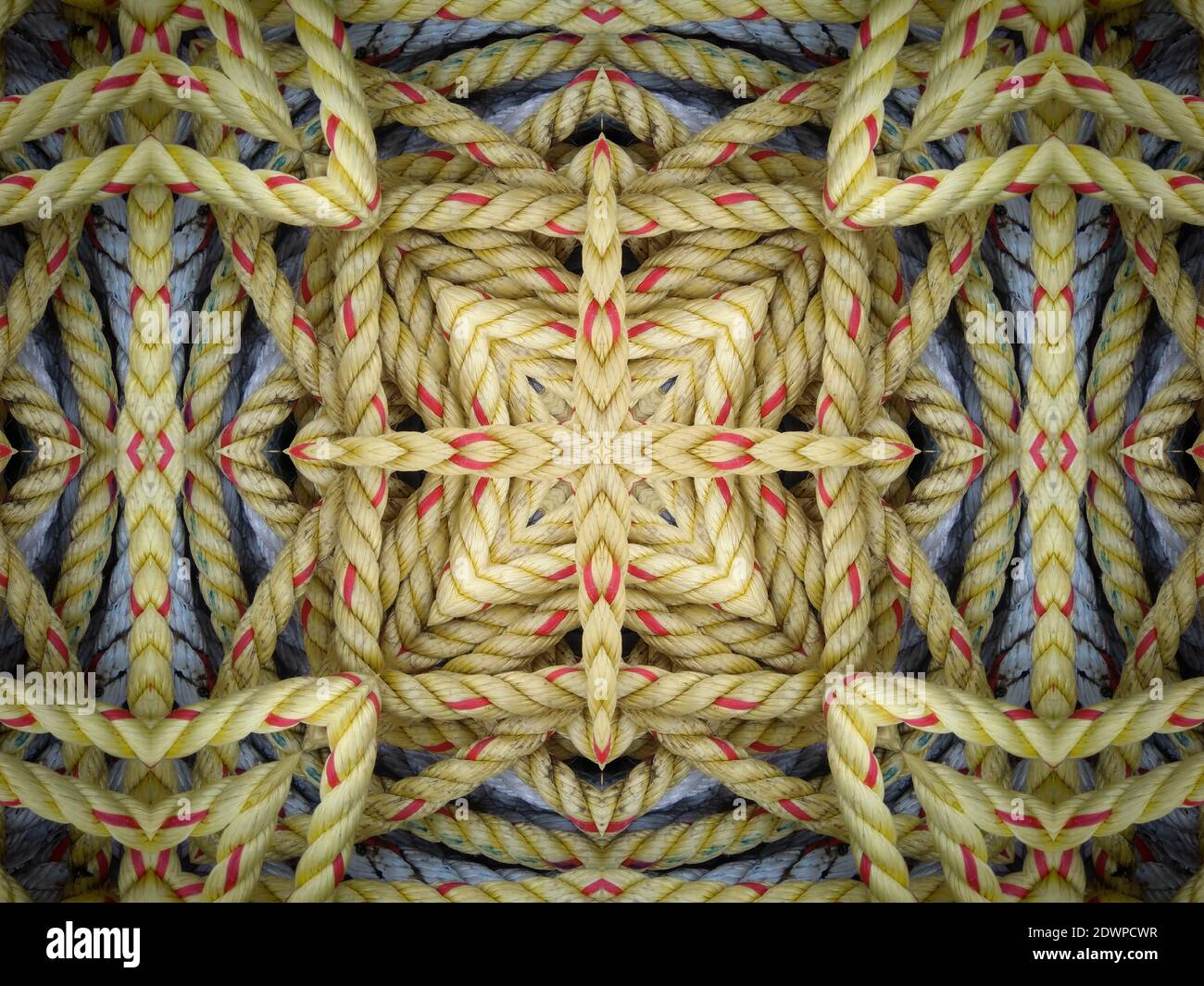 A kaleidoscope pattern of overlapping and knotted rope forming ...