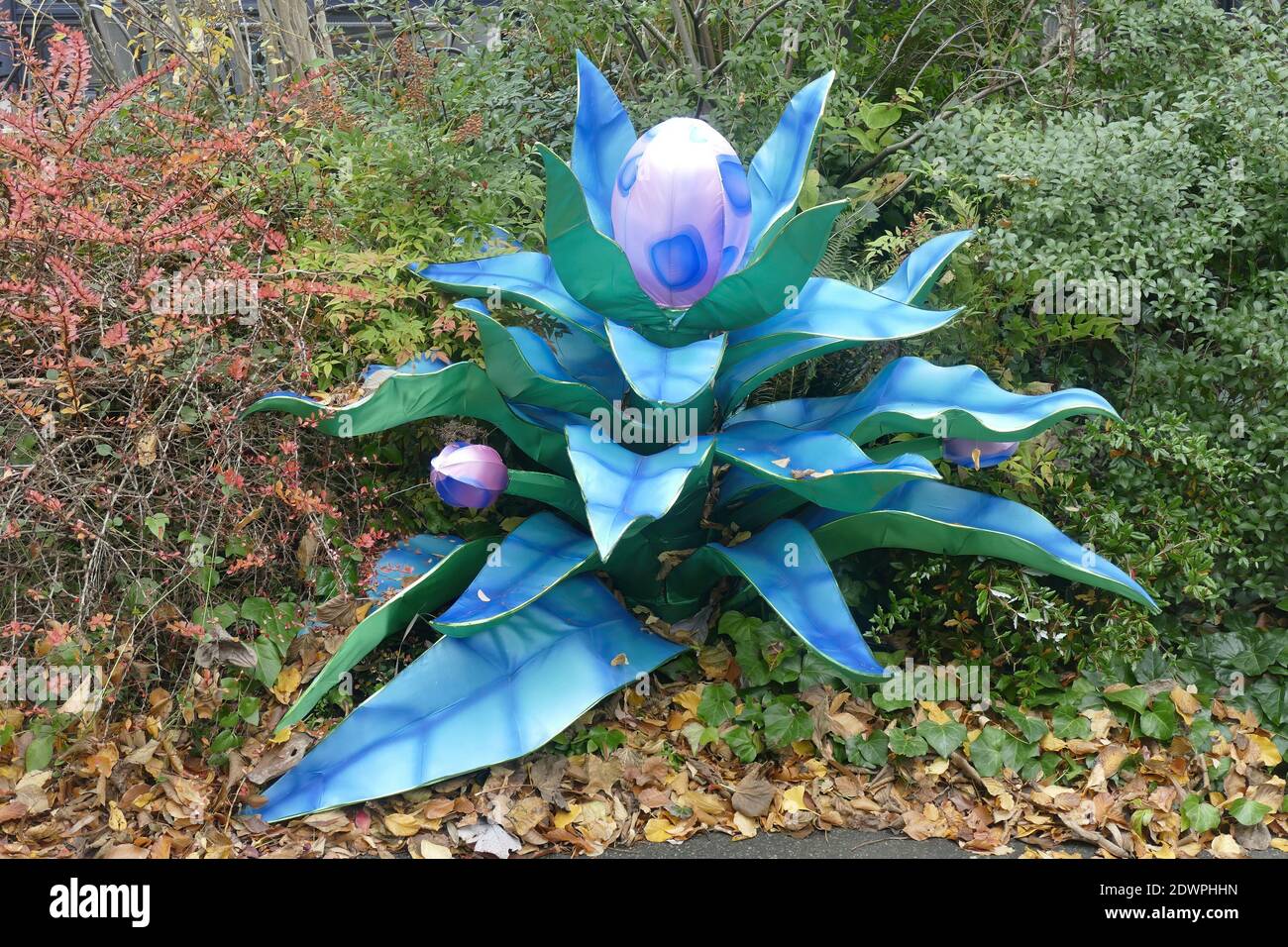 A horizontal shot of a plant statue in the park during the fall in ...