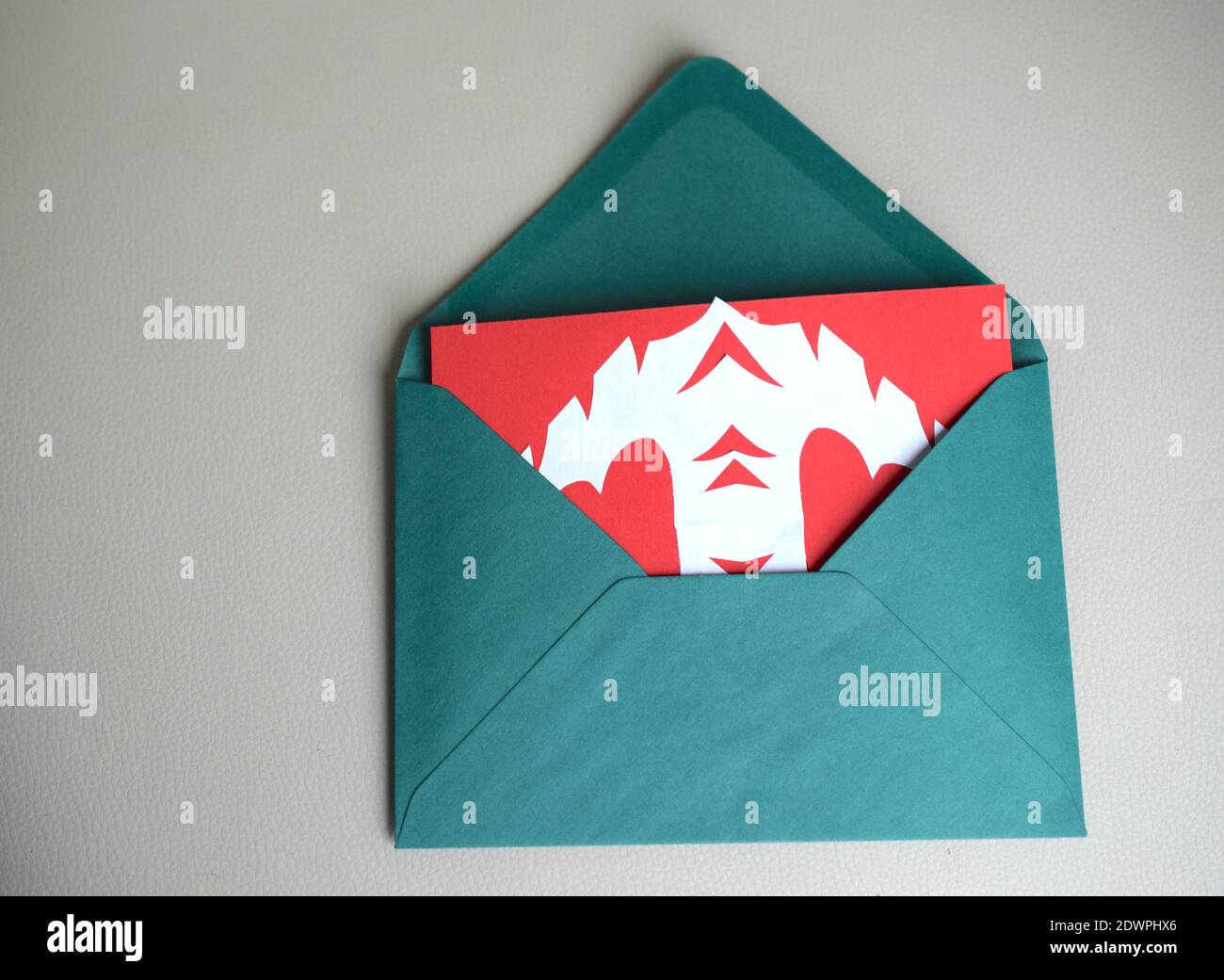 Handmade Christmas card in green envelope Stock Photo - Alamy