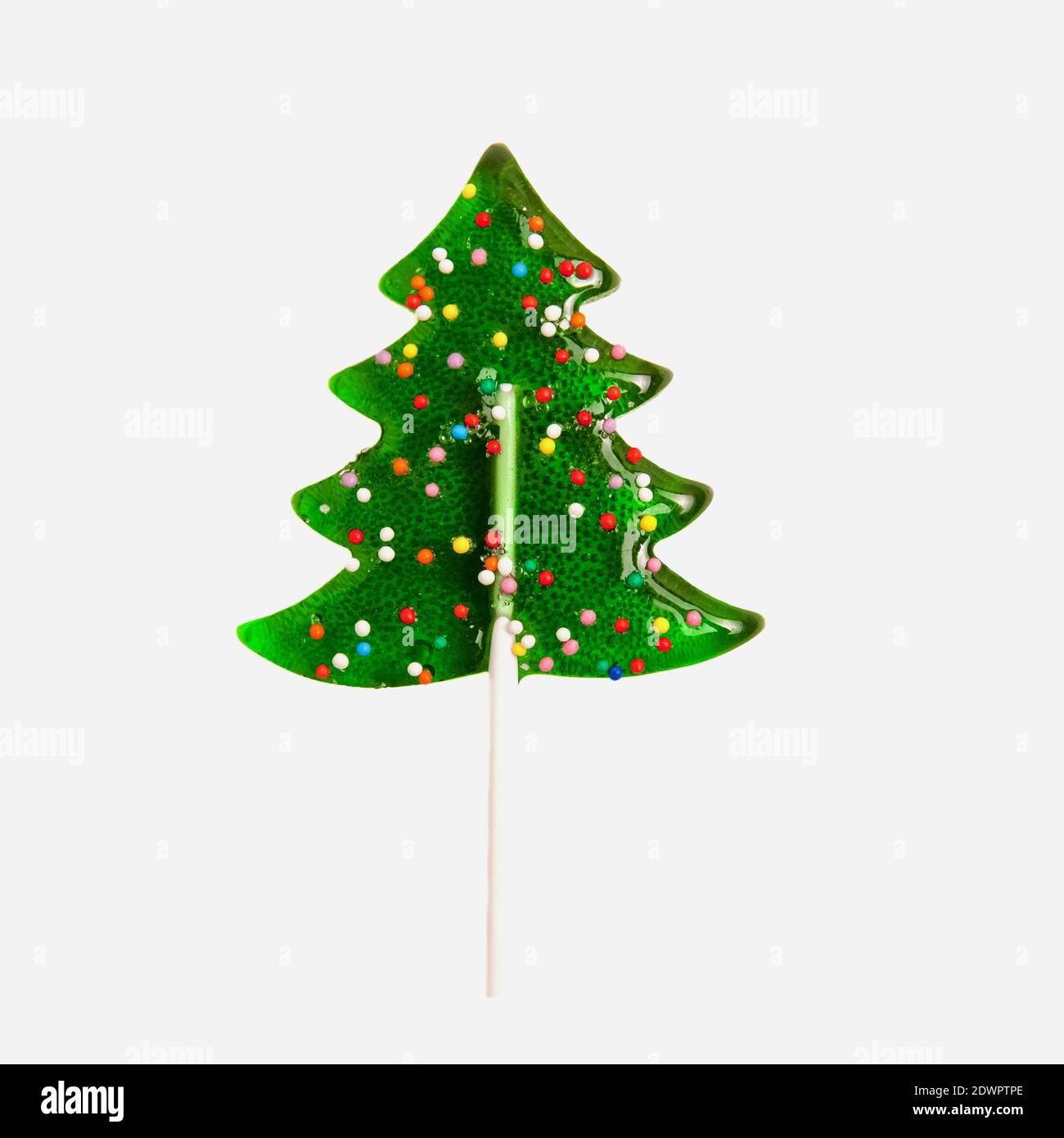 Christmas treats: a Lollipop in the form of a fir tree on an isolated ...