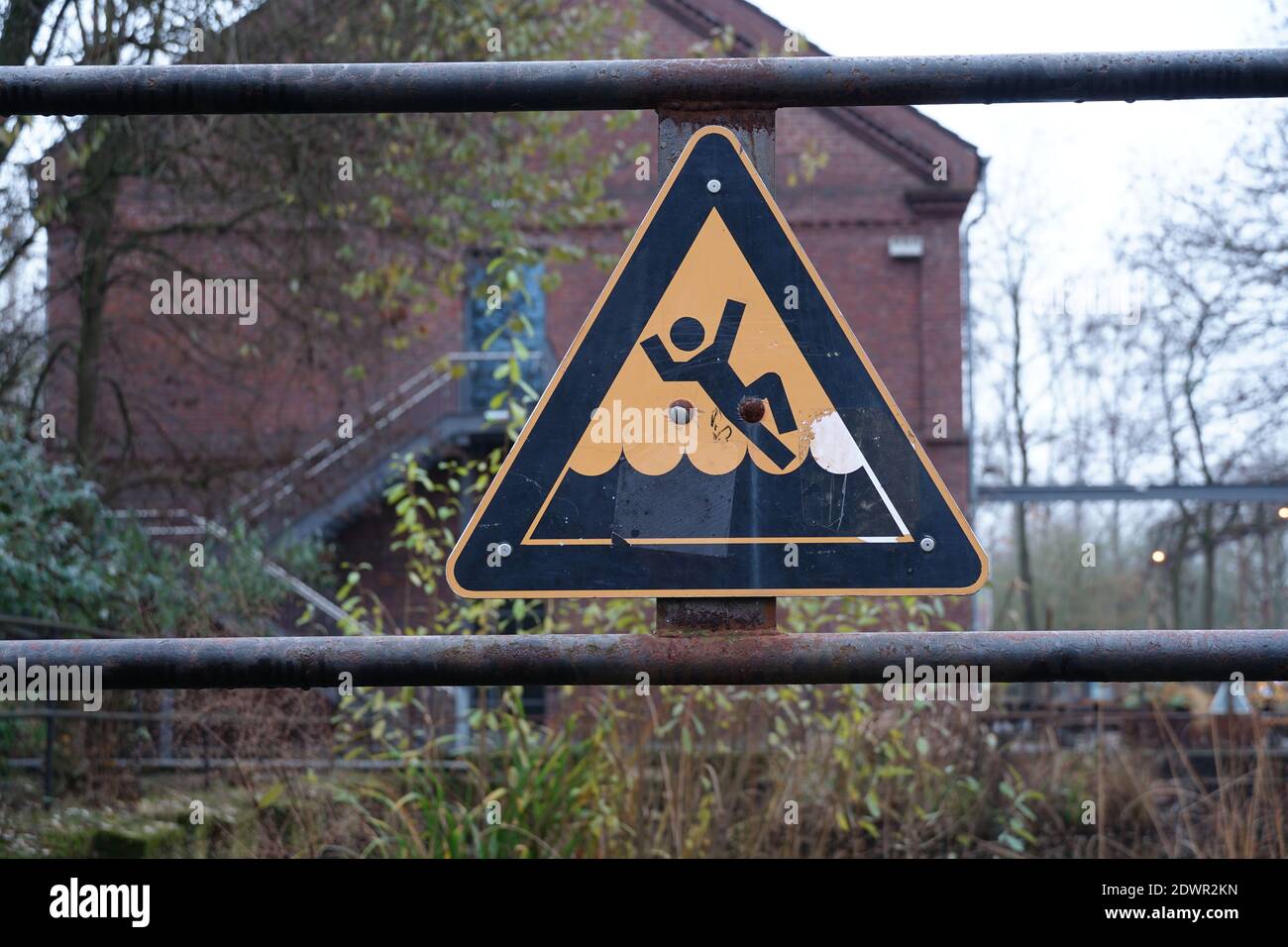 Yellow and black warning sign about deep water hi-res stock photography ...