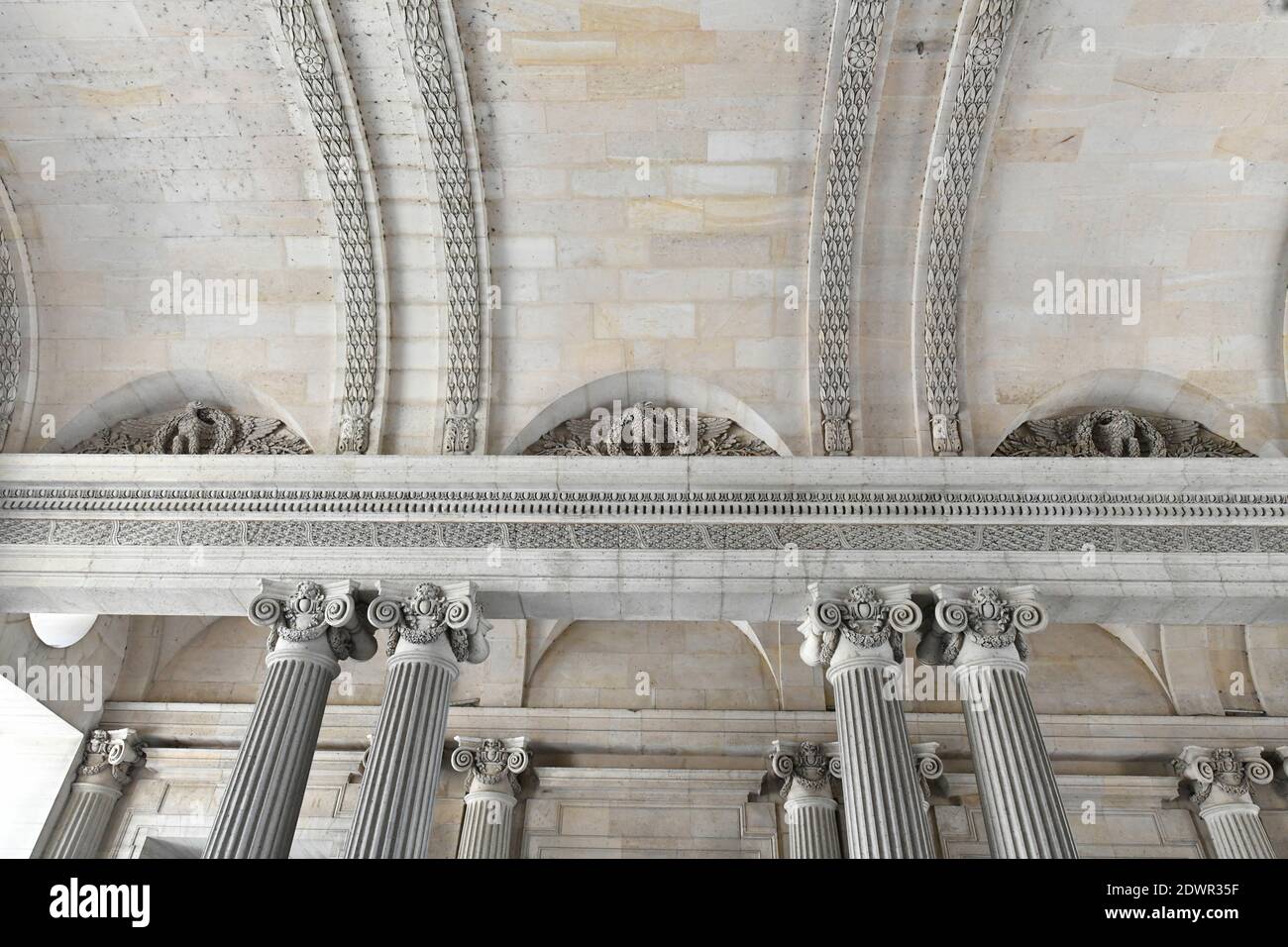 A low angle shot of a beautiful architectural building ceiling standing ...