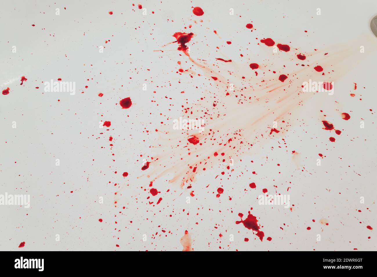 Blood draining from white bathroom basin. Bloody stains in the ...