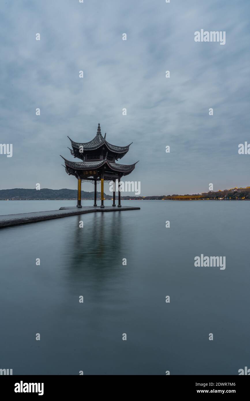 Sunset view of Jixian pavilion, the historic landmark in at West Lake ...