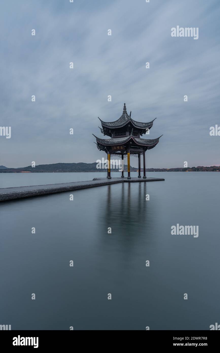 Sunset view of Jixian pavilion, the historic landmark in at West Lake ...