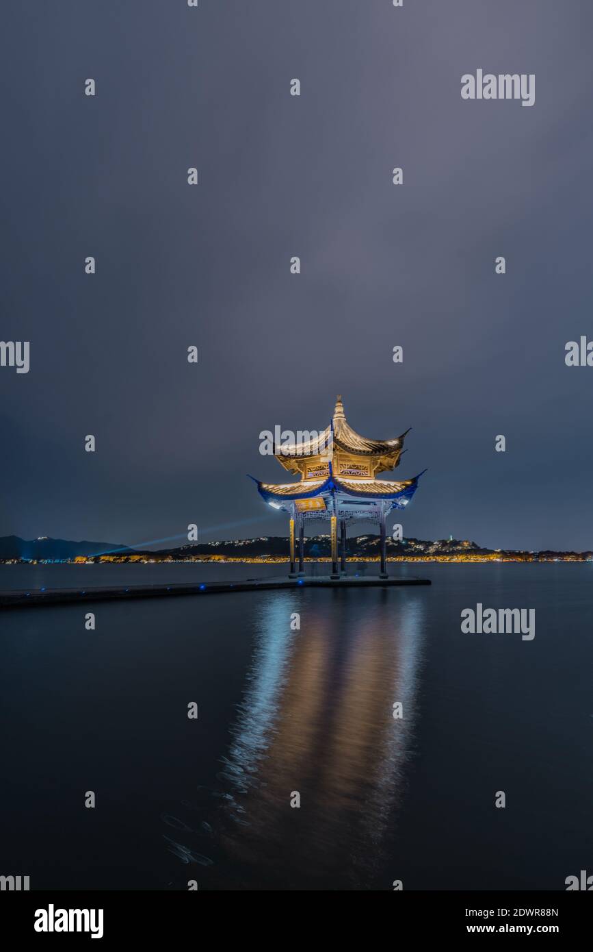 Night view of Jixian pavilion, the historic landmark in at West Lake ...