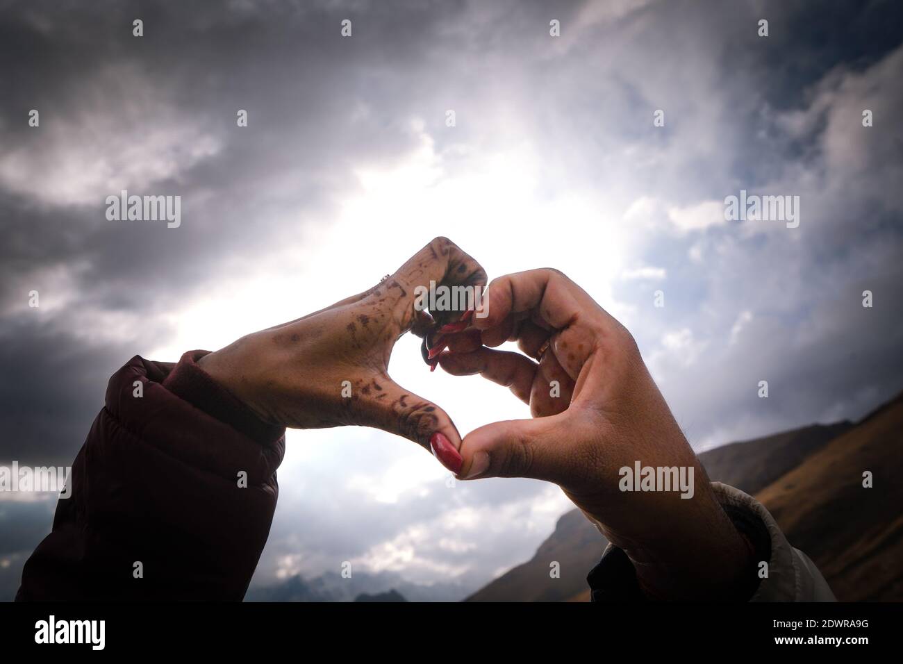 A closeup shot of married couple hands forming a heart Stock Photo - Alamy