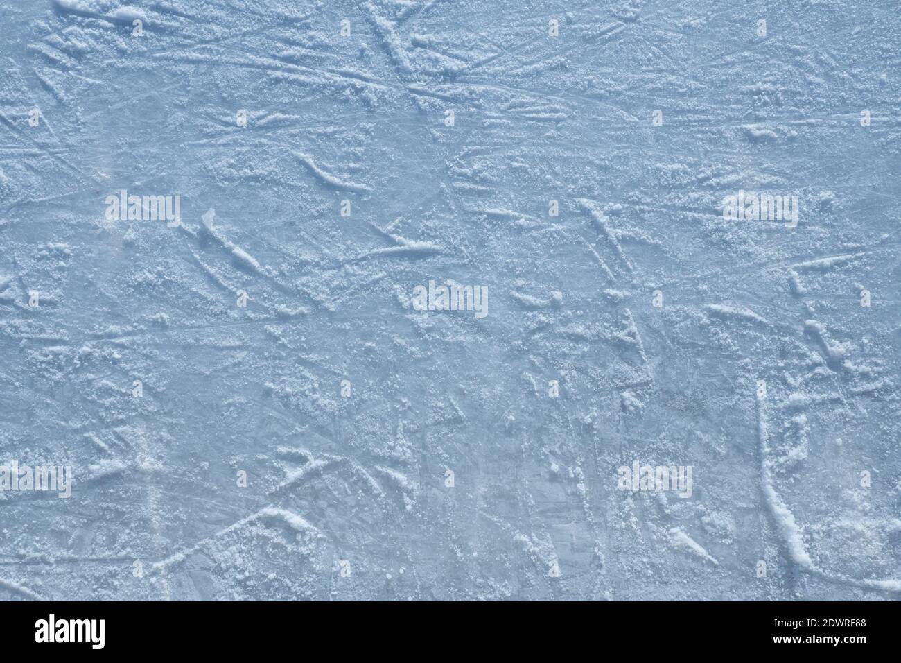 Ice skating rink, cutting ice, snow. Winter sport. Scratches on the ...