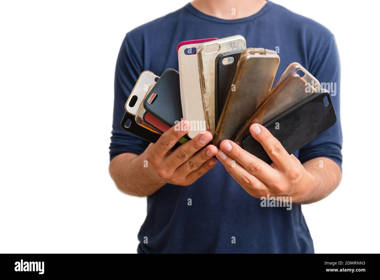 Man holding a choice of multicolored plastic back covers for mobile ...