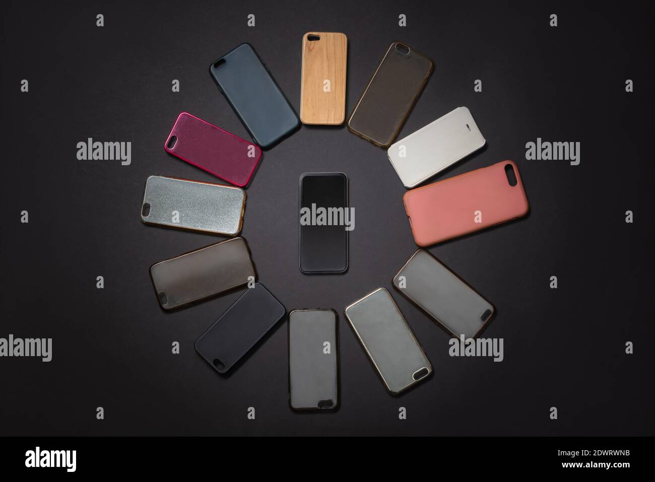 Pile of multicolored plastic back covers for mobile phones on black ...