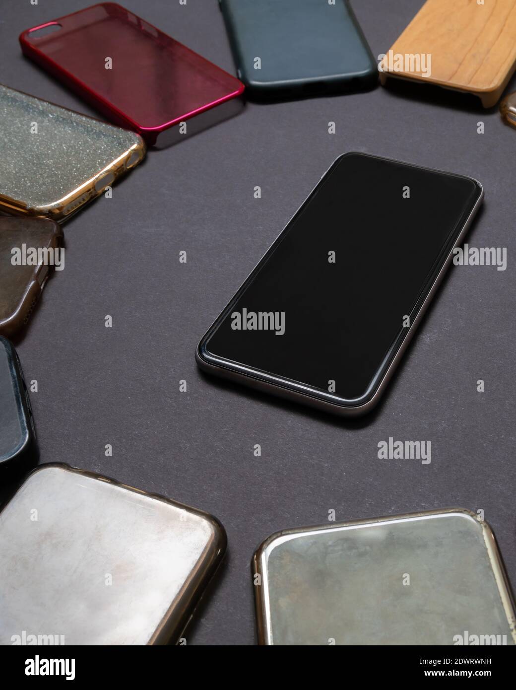 Pile of multicolored plastic back covers for mobile phones on black ...