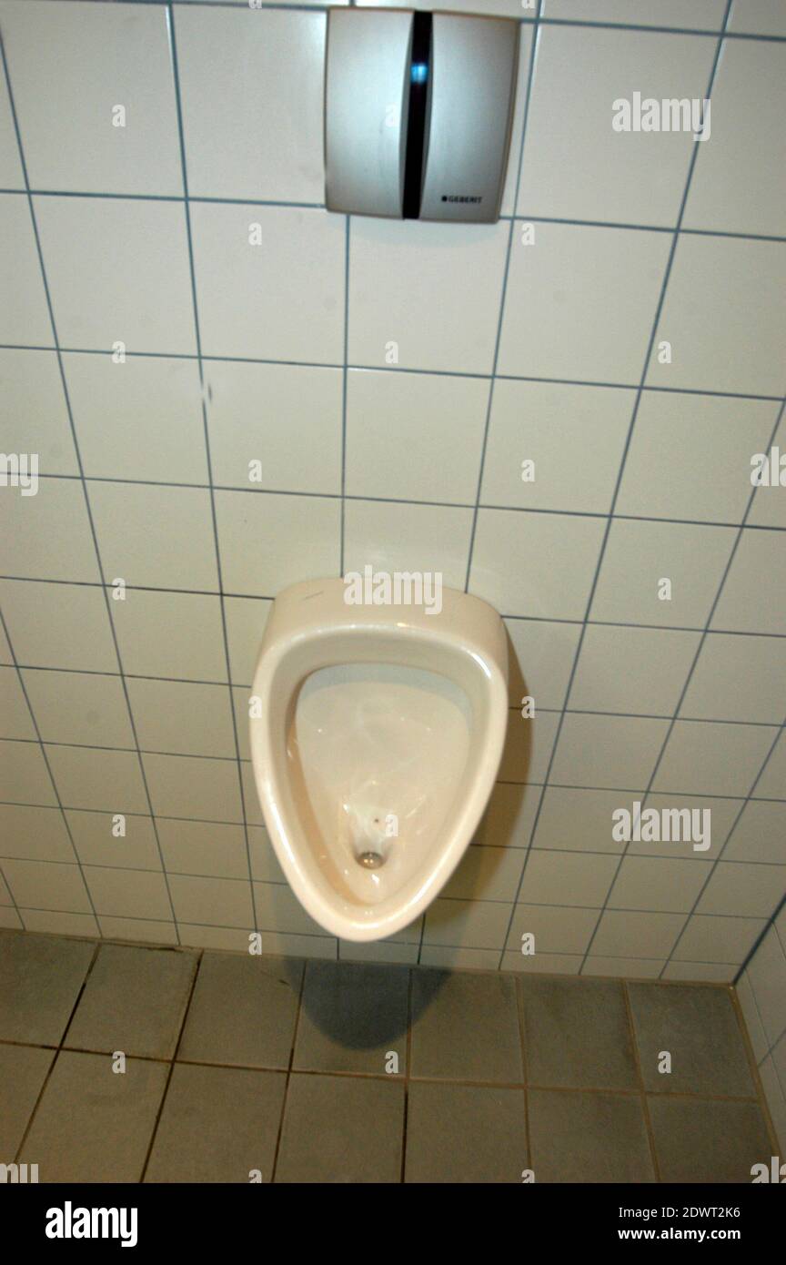 an urinal in a restroom, body hygiene and basic needs Stock Photo - Alamy