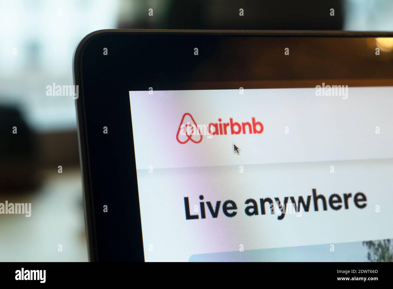 Airbnb logo on a computer screen. Home page of the Internet resource ...
