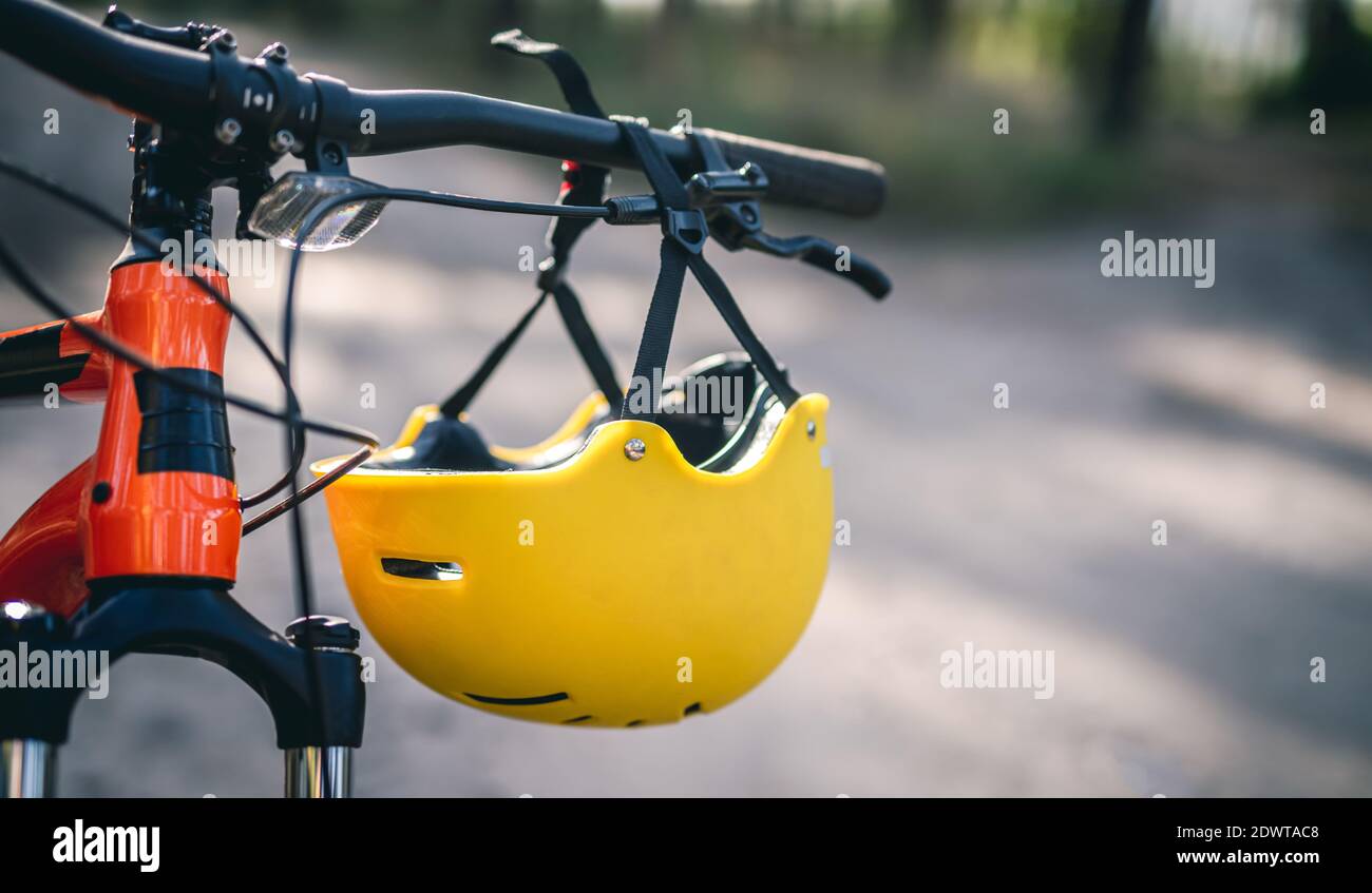 Helmet hanging on bike hi-res stock photography and images - Alamy
