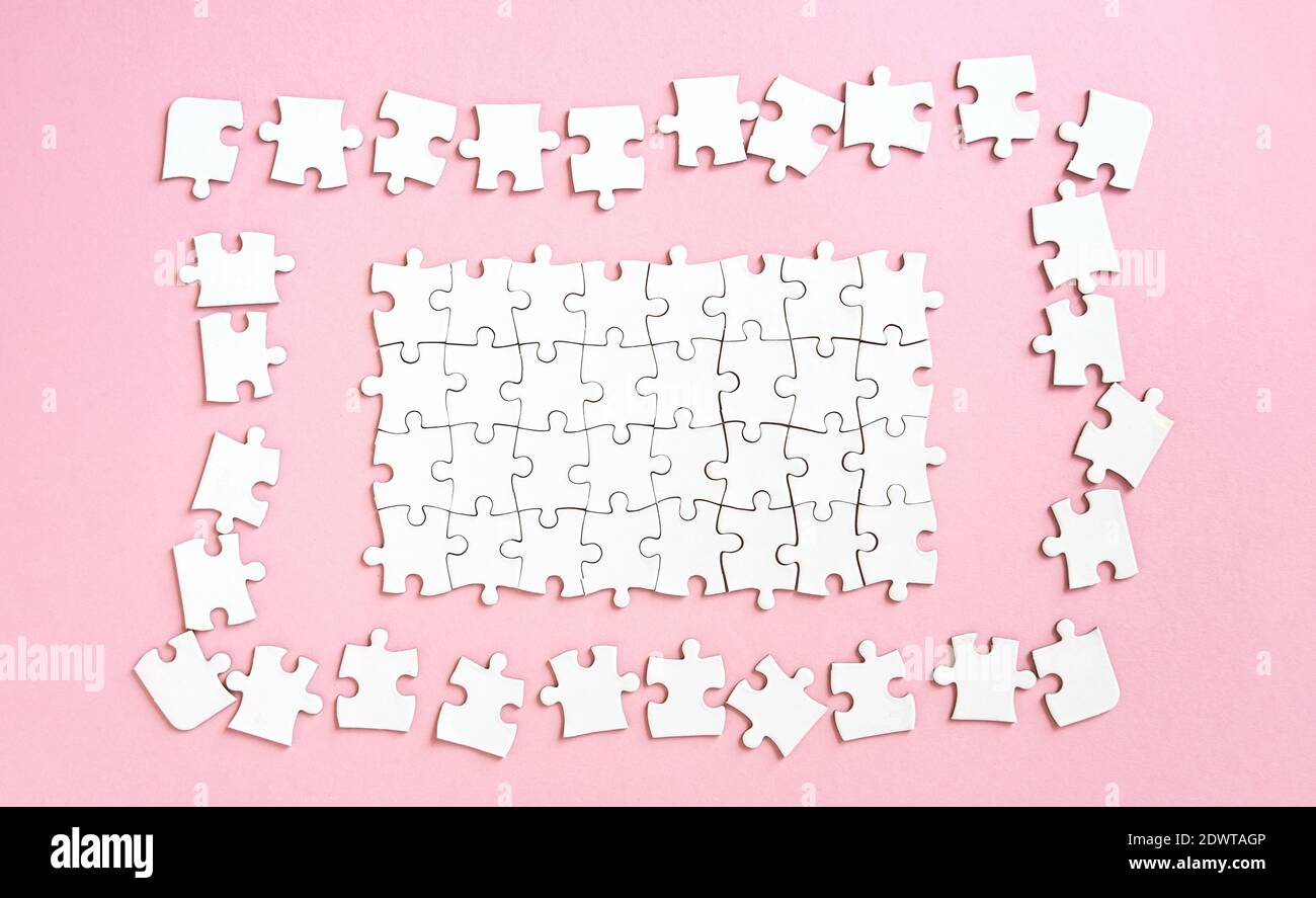 White jigsaw puzzle with unconnected pieces Stock Photo - Alamy