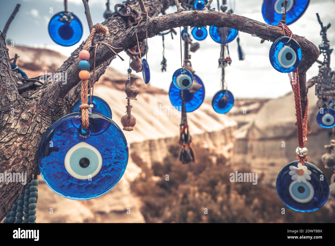 Amulets against evil eye hanging on tree branch in Turkey Stock Photo ...