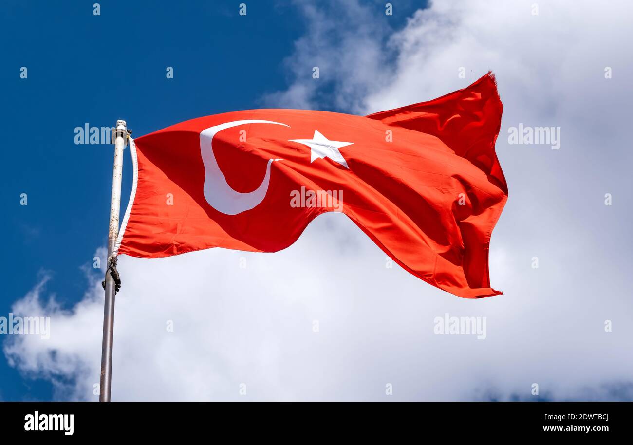 National flag of Turkey waving on blue sky background Stock Photo - Alamy