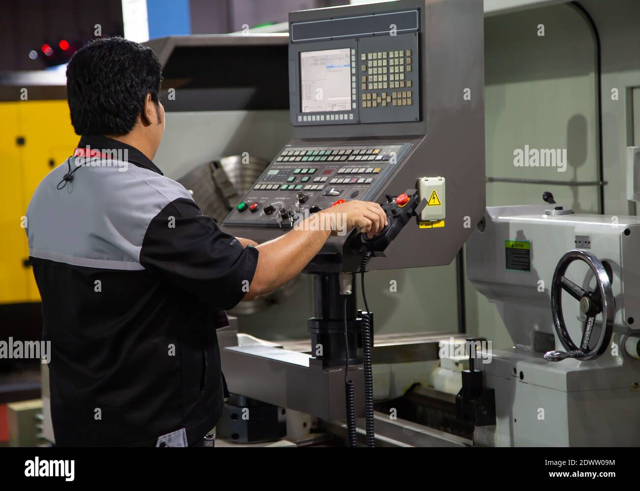 Technician operating lathe cutting machine hi-res stock photography and images - Alamy