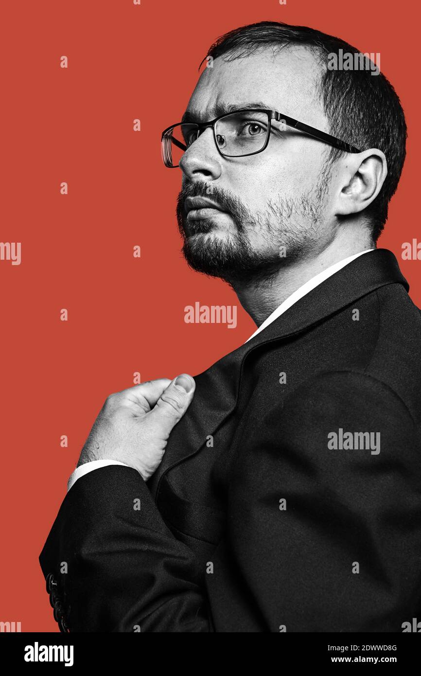 Portrait of handsome man isolated over red background. Human emotions ...