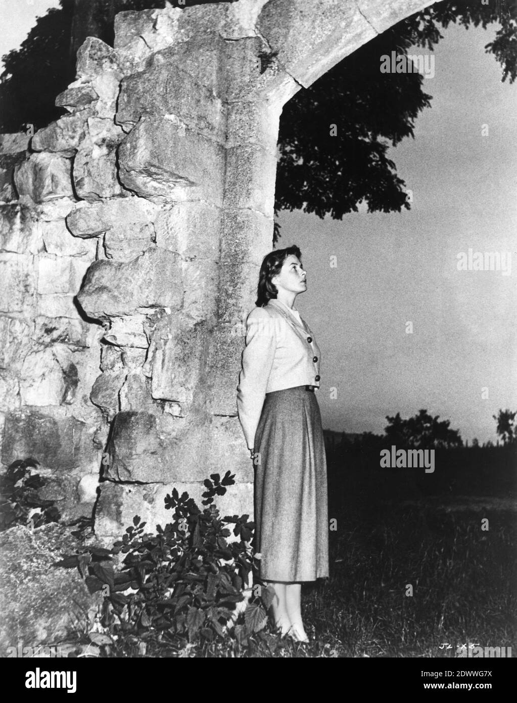 INGRID BERGMAN meditating before the ruins of the actual tower outside ...