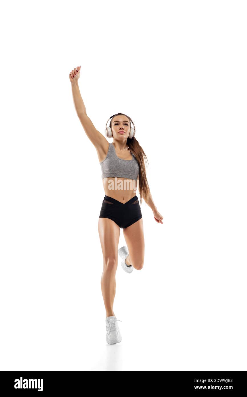 Winner. Caucasian professional female athlete, runner training isolated ...