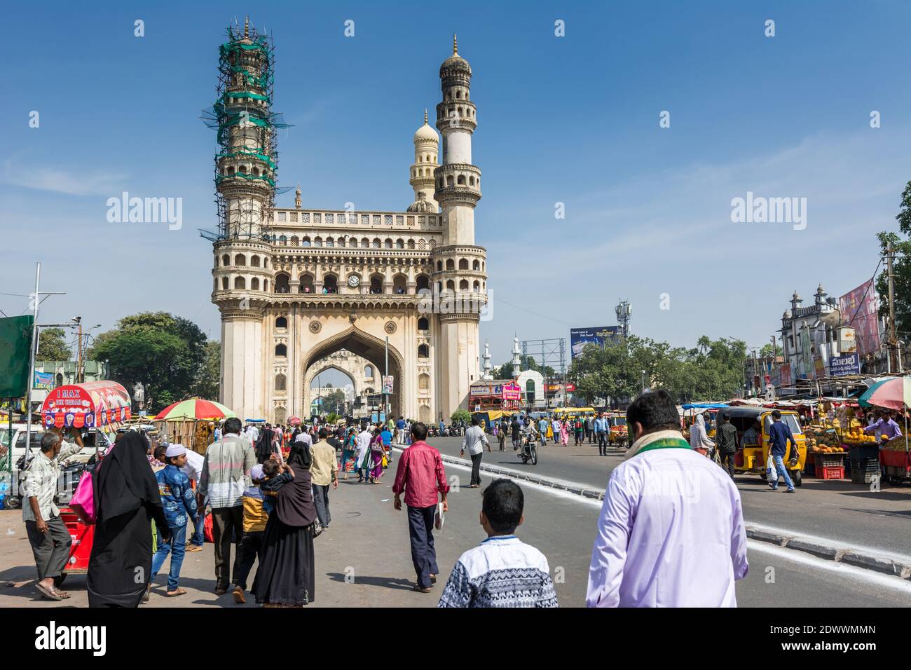 Pedestrians walking at Charminar street of Hyderabad with background of ...