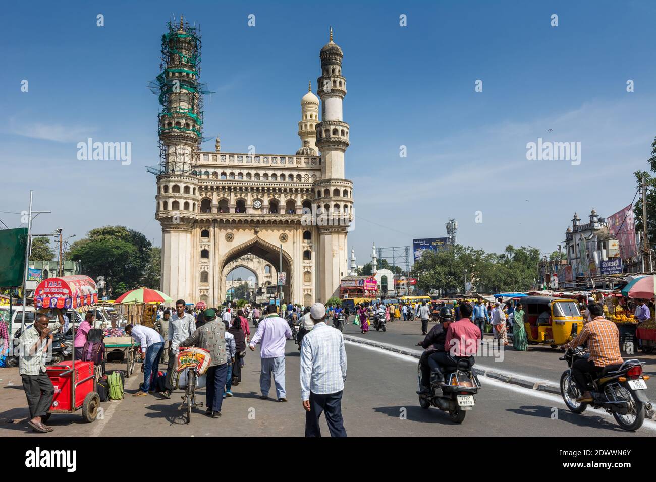 Pedestrians walking at Charminar street of Hyderabad with background of ...