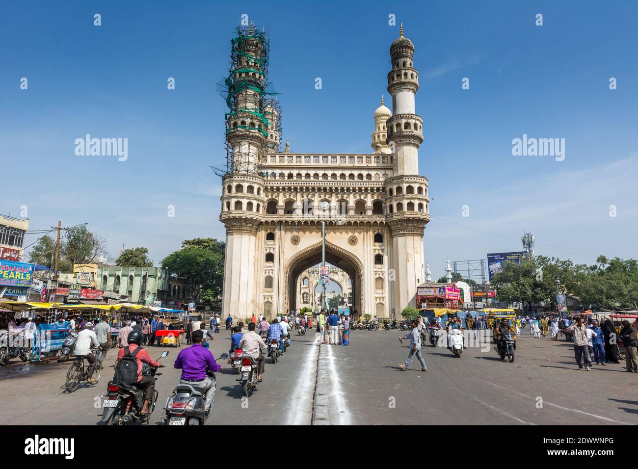 Pedestrians walking at Charminar street of Hyderabad with background of ...
