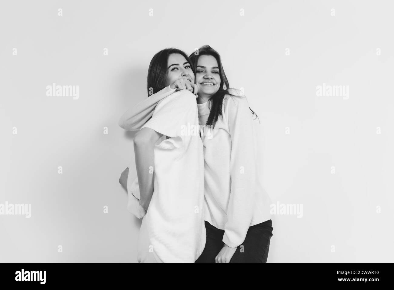 Black girl hugs white girl hi-res stock photography and images - Alamy