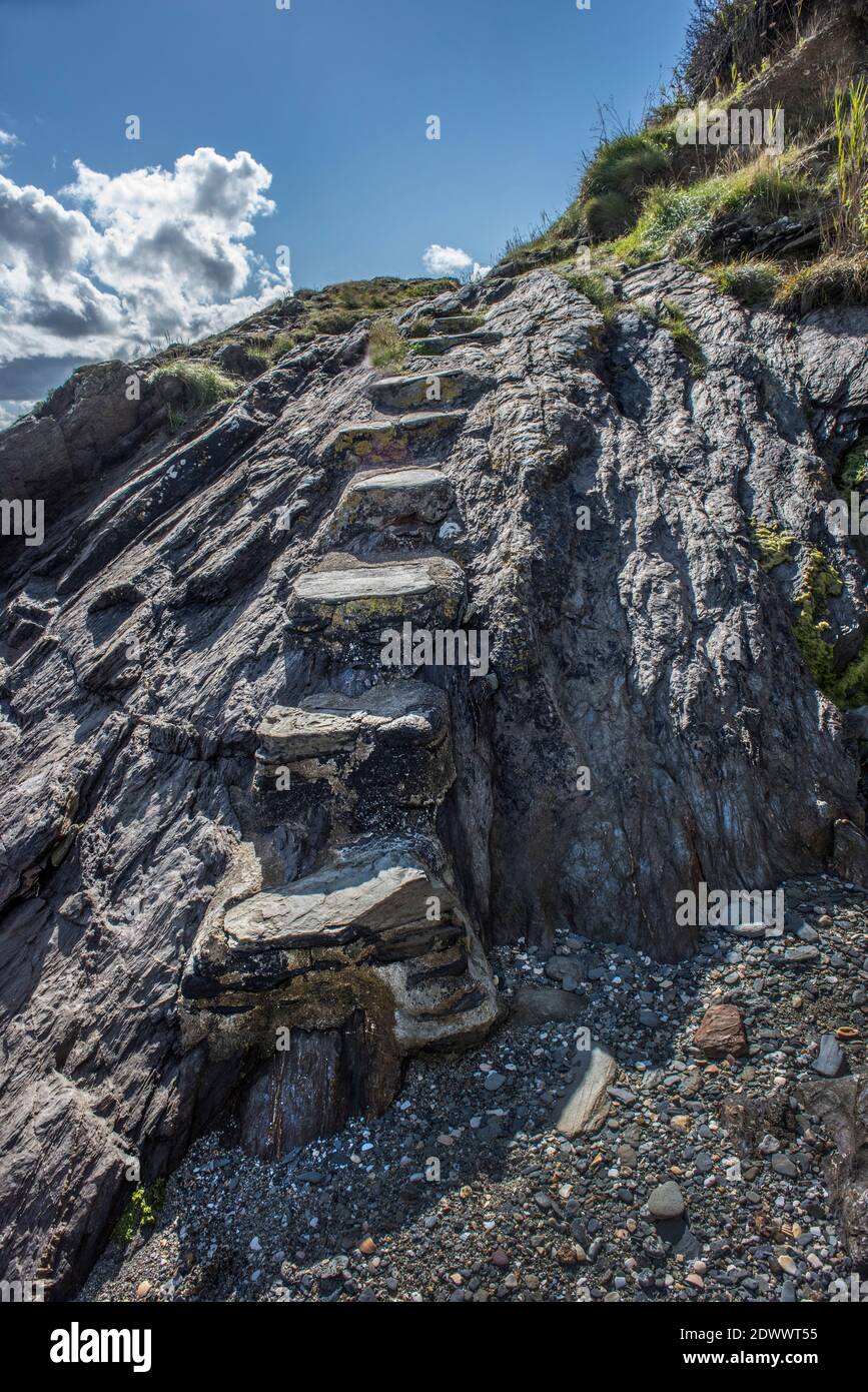 Stone steps leading down to rocky beach near St Mawes Cornwall Stock ...