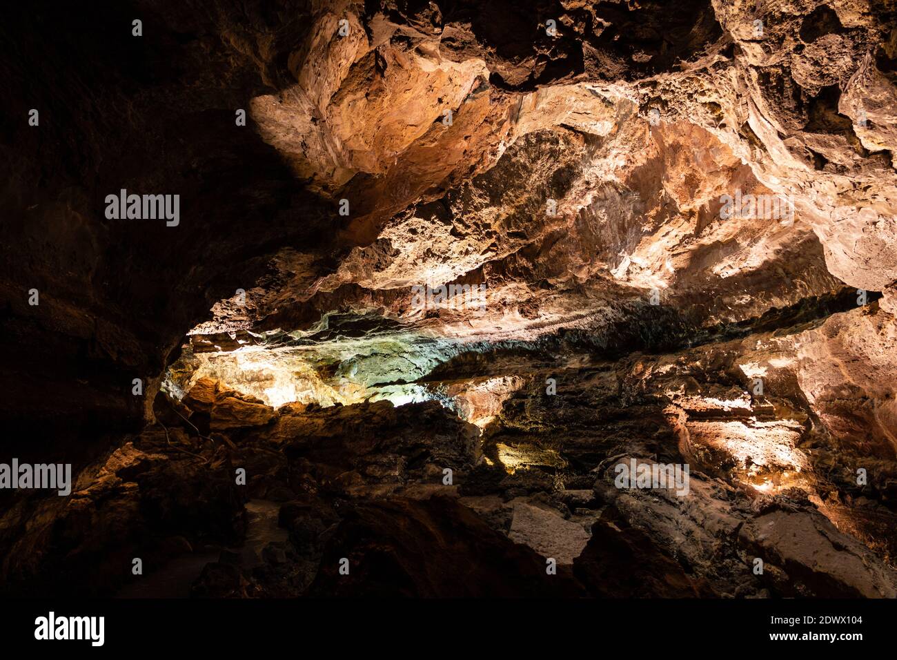 Brown cave lava tube illuminated in Canary Islands. Geological cavern ...