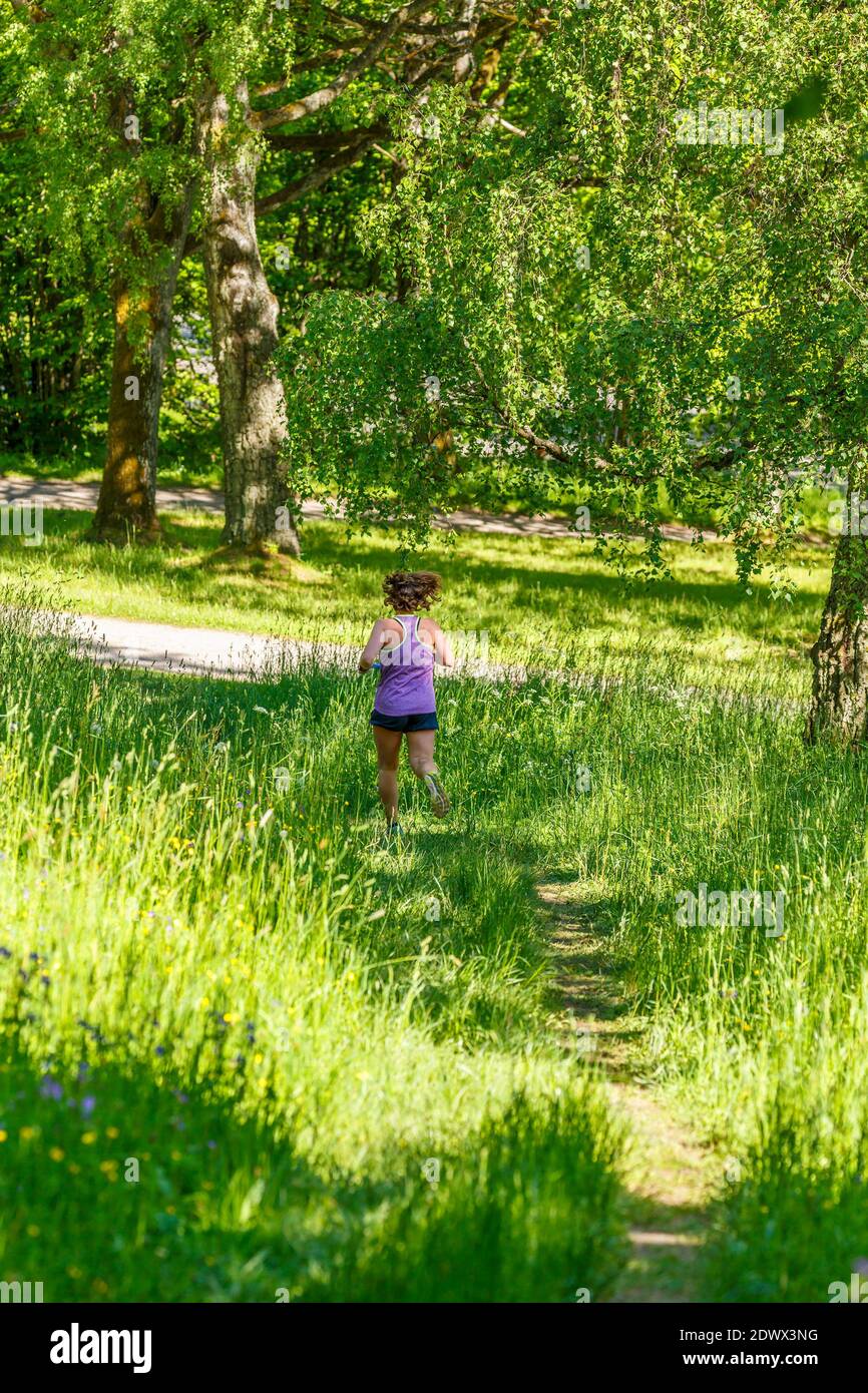 Child running on path rear view hi-res stock photography and images - Alamy