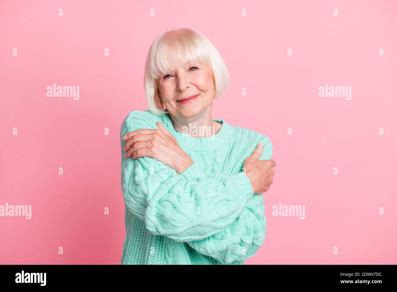 Photo portrait of cute lovely old lady with blonde hair in teal sweater ...