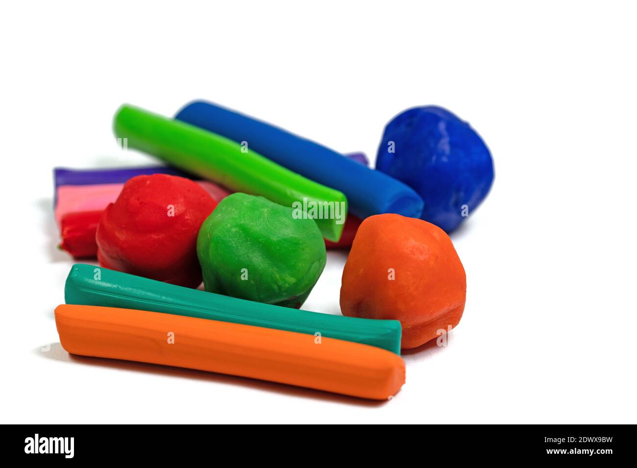 Colorful plasticine against a white background Stock Photo - Alamy