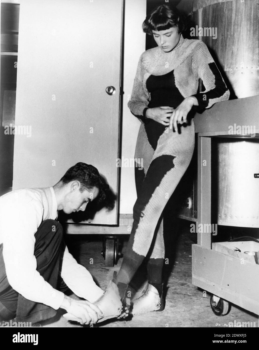 INGRID BERGMAN on set candid having her armour fitted for JOAN OF ARC ...